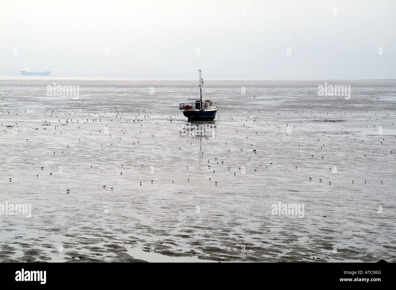 tide mudbank sea gone out going out east coast Stock Photo - Alamy