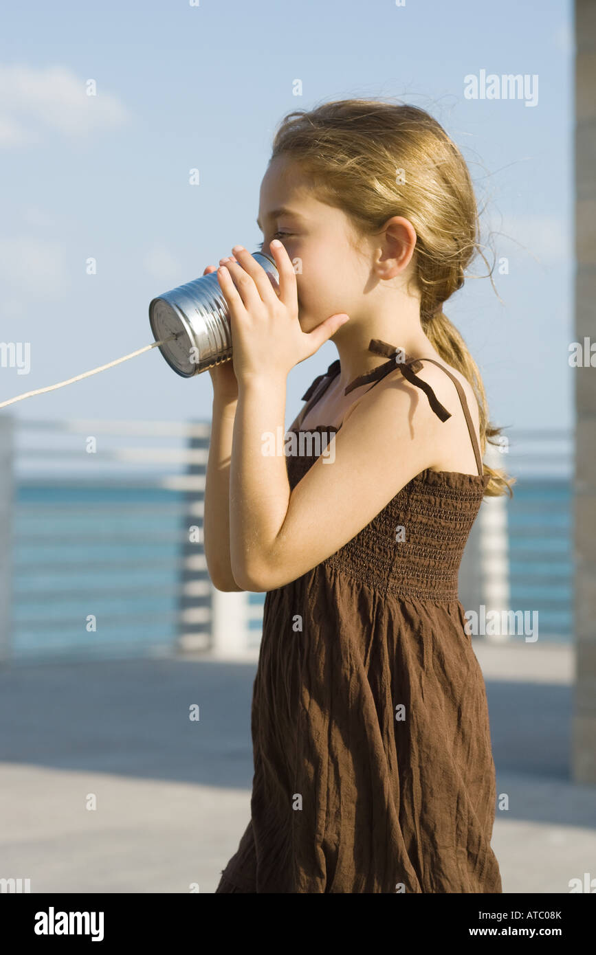 Kids playing tin can telephone High Resolution Stock Photography and ...