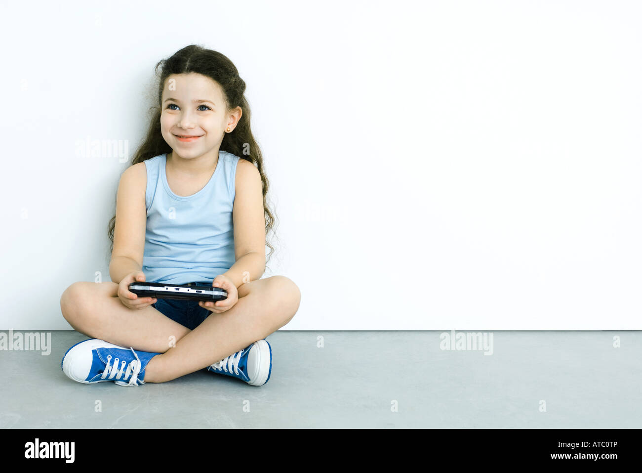 Kids playing handheld video game hi-res stock photography and images ...