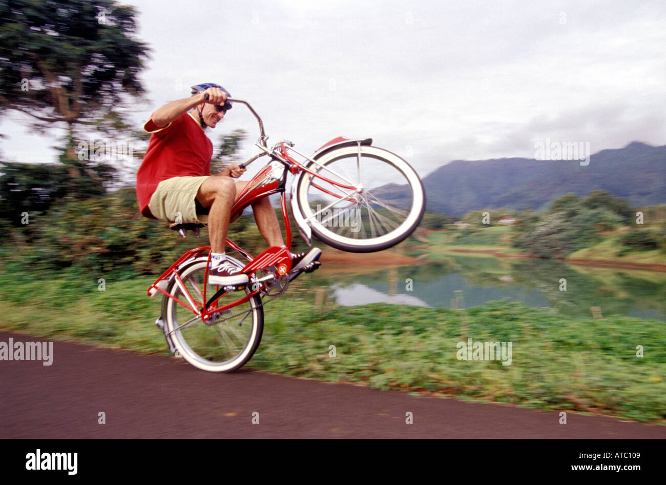 Hawaii Kauai wheely on cruiser type bicycle MR available Stock Photo ...
