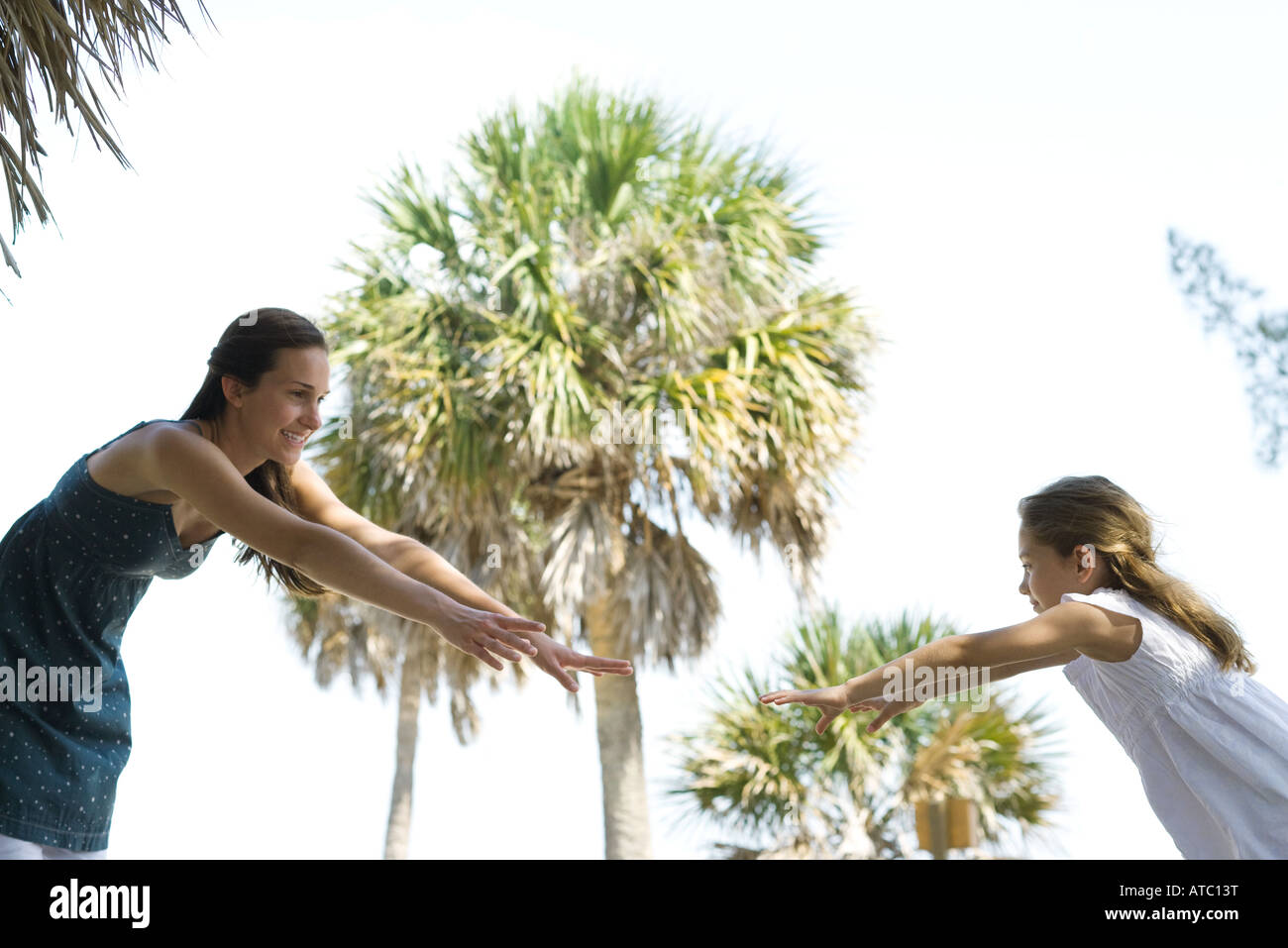 Two People Reaching For Each Other