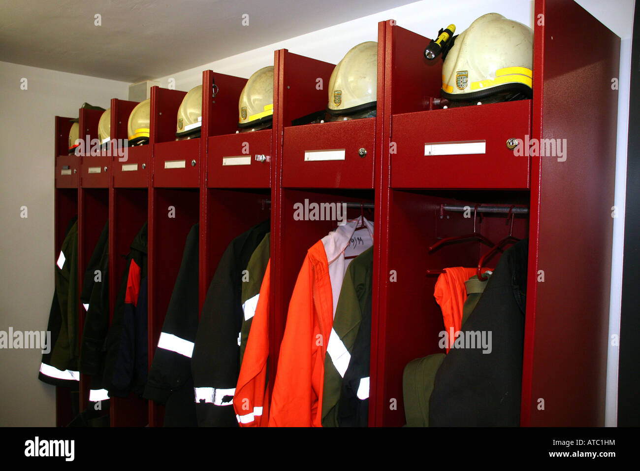 Fire-brigade pint with helmets and jackets Stock Photo - Alamy