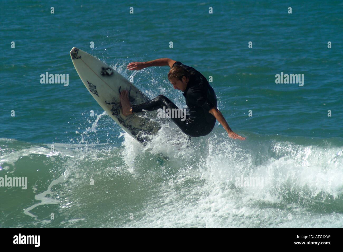 Surfer riding on top of a wave Stock Photo - Alamy