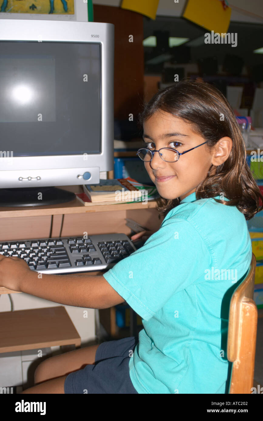 young school girl using computer Stock Photo - Alamy