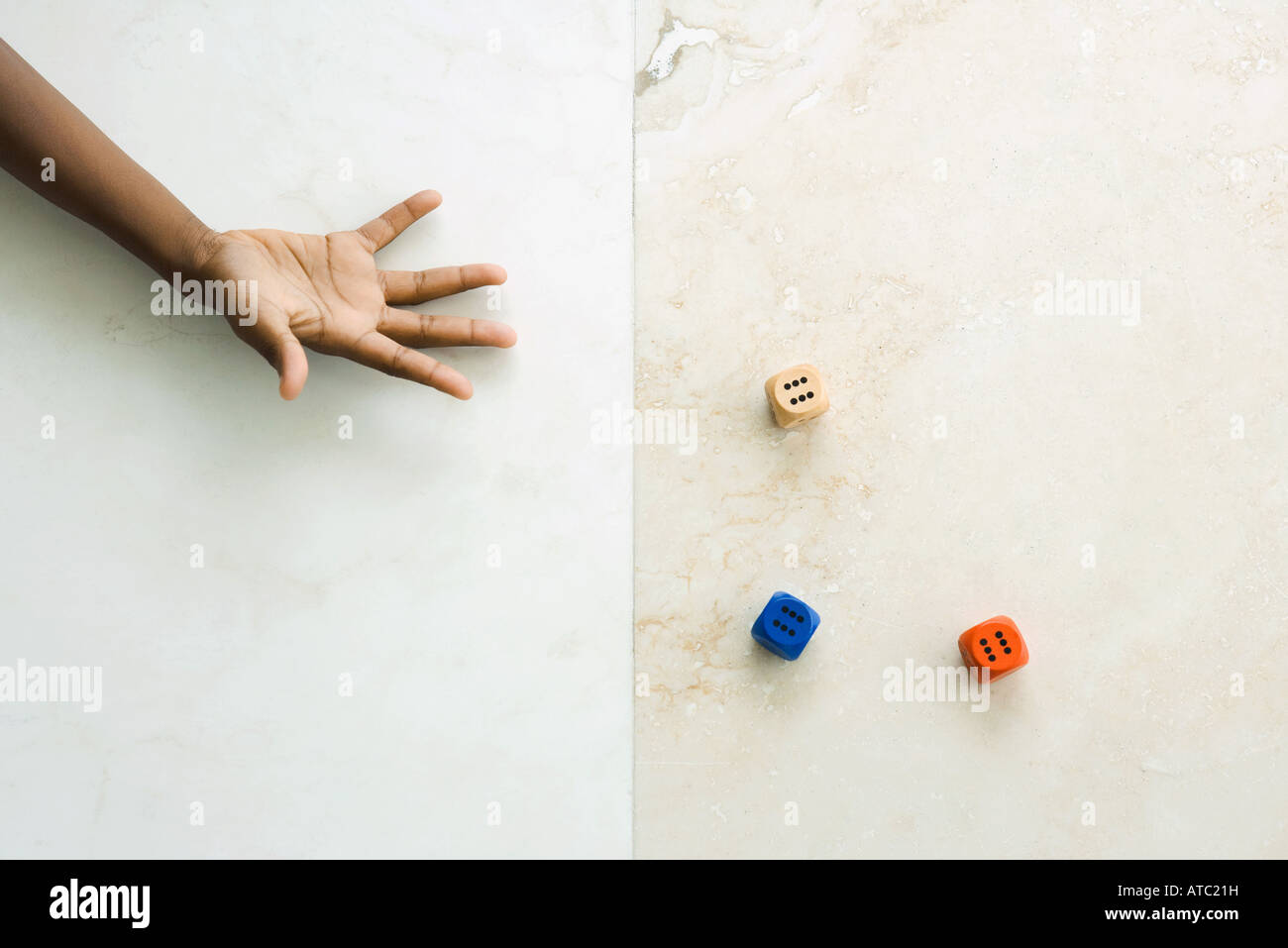 Child throwing dice, cropped view of hand Stock Photo - Alamy