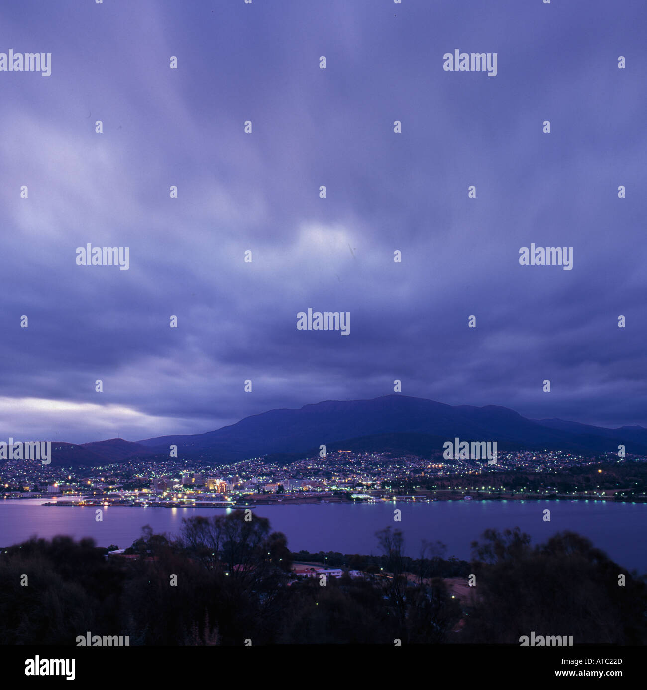 Evening view of Hobart & suburbs lighting up at dusk with Mount ...