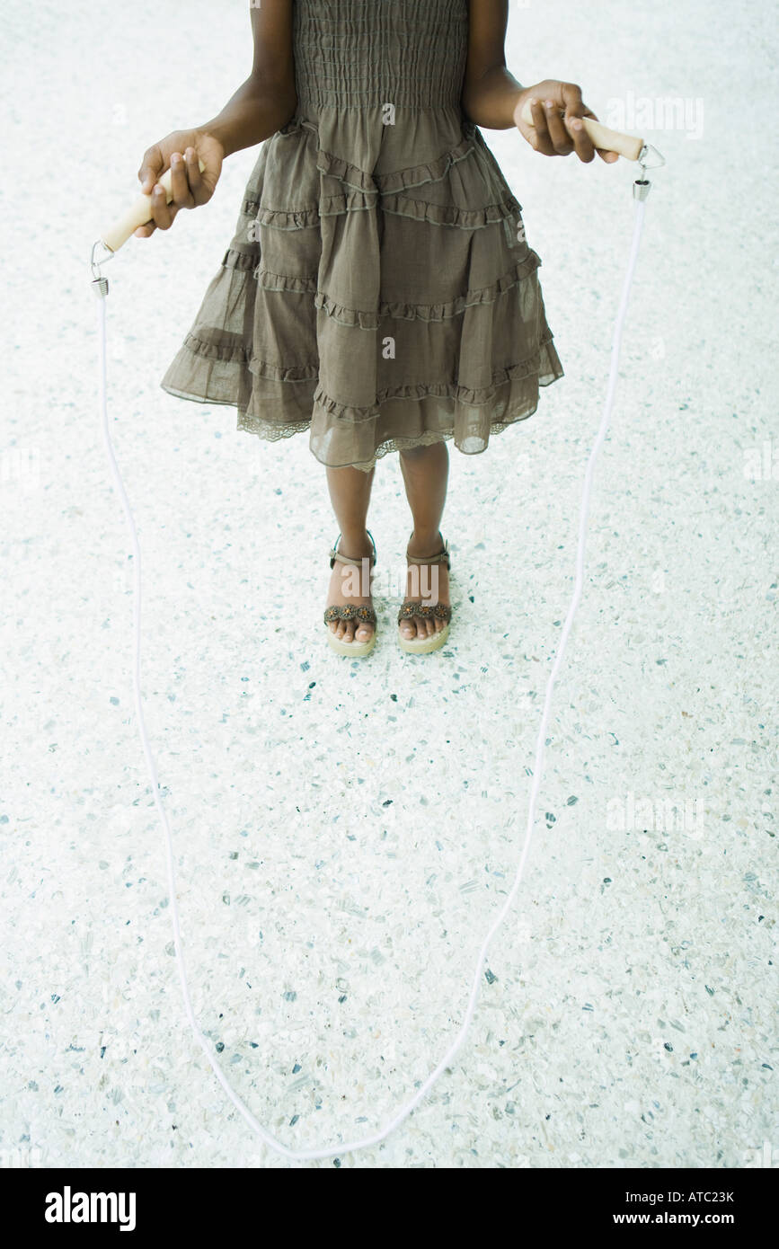 Girl holding jump rope, cropped view Stock Photo - Alamy