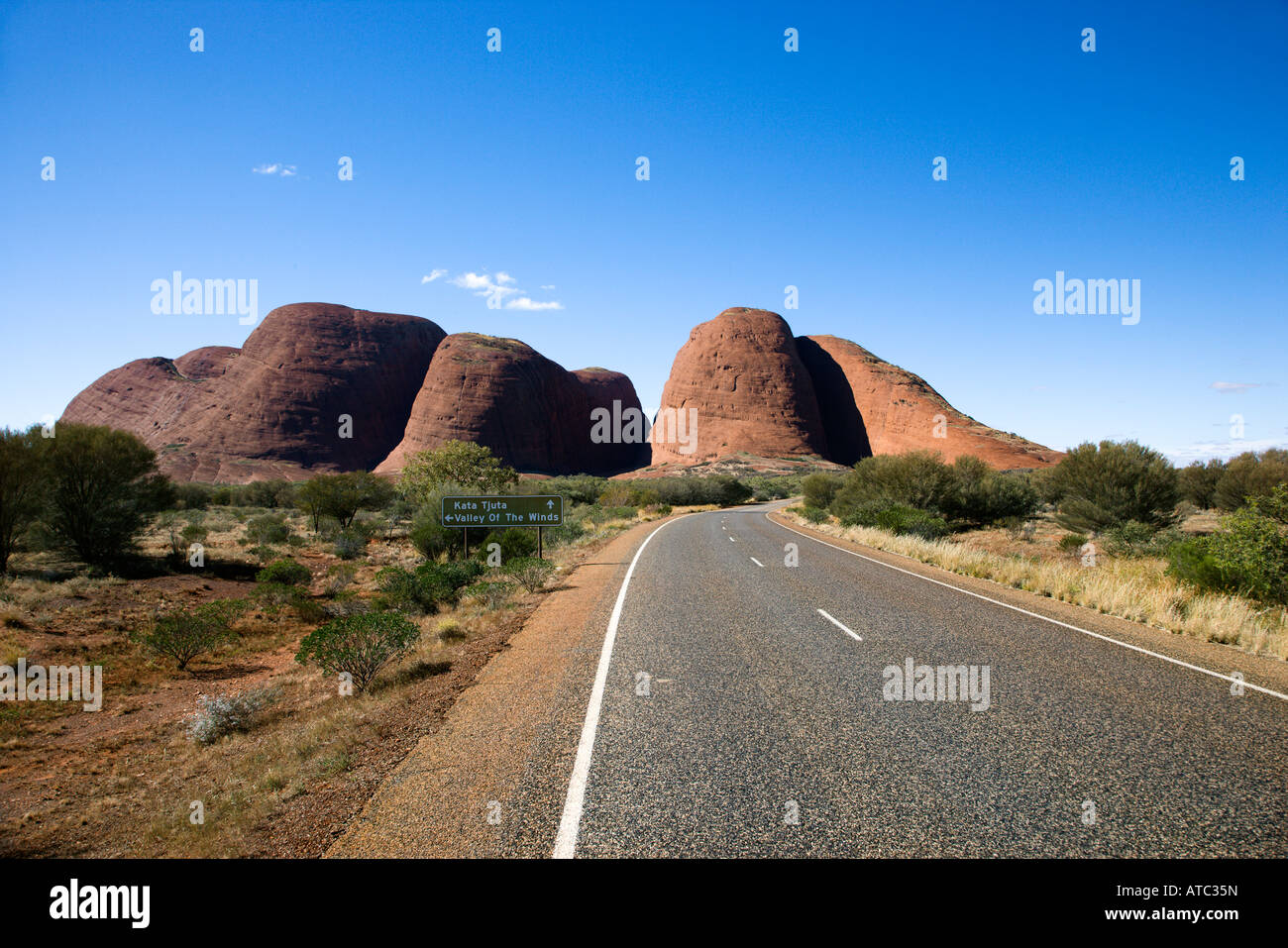 Two lane road in Uluru Kata Tjuta National Park Australia with Mount ...