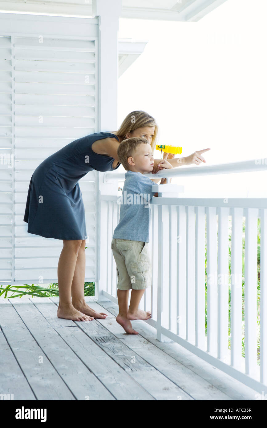 Woman bending over children hi-res stock photography and images - Alamy