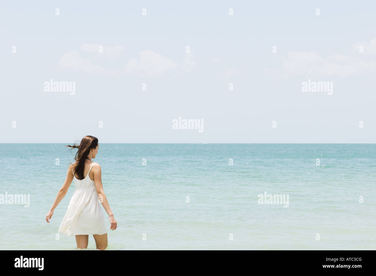 Woman in dress wading in water hi-res stock photography and images - Alamy