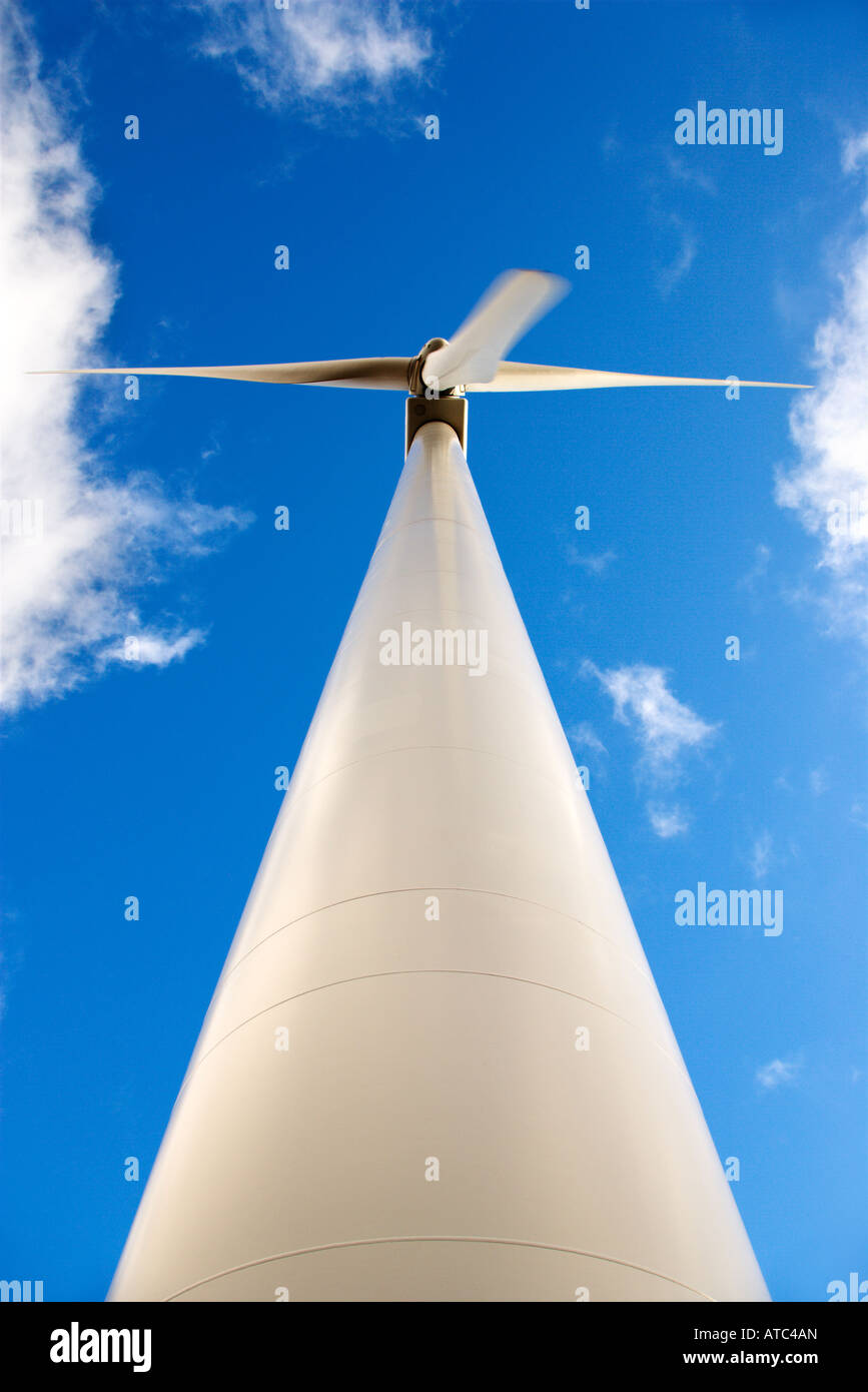 Perspective shot of wind turbine against blue sky Stock Photo - Alamy