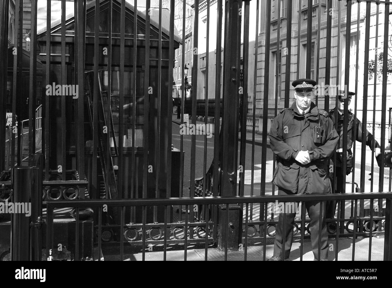 Police on guard at the gates of Downing Street, home of the Prime ...