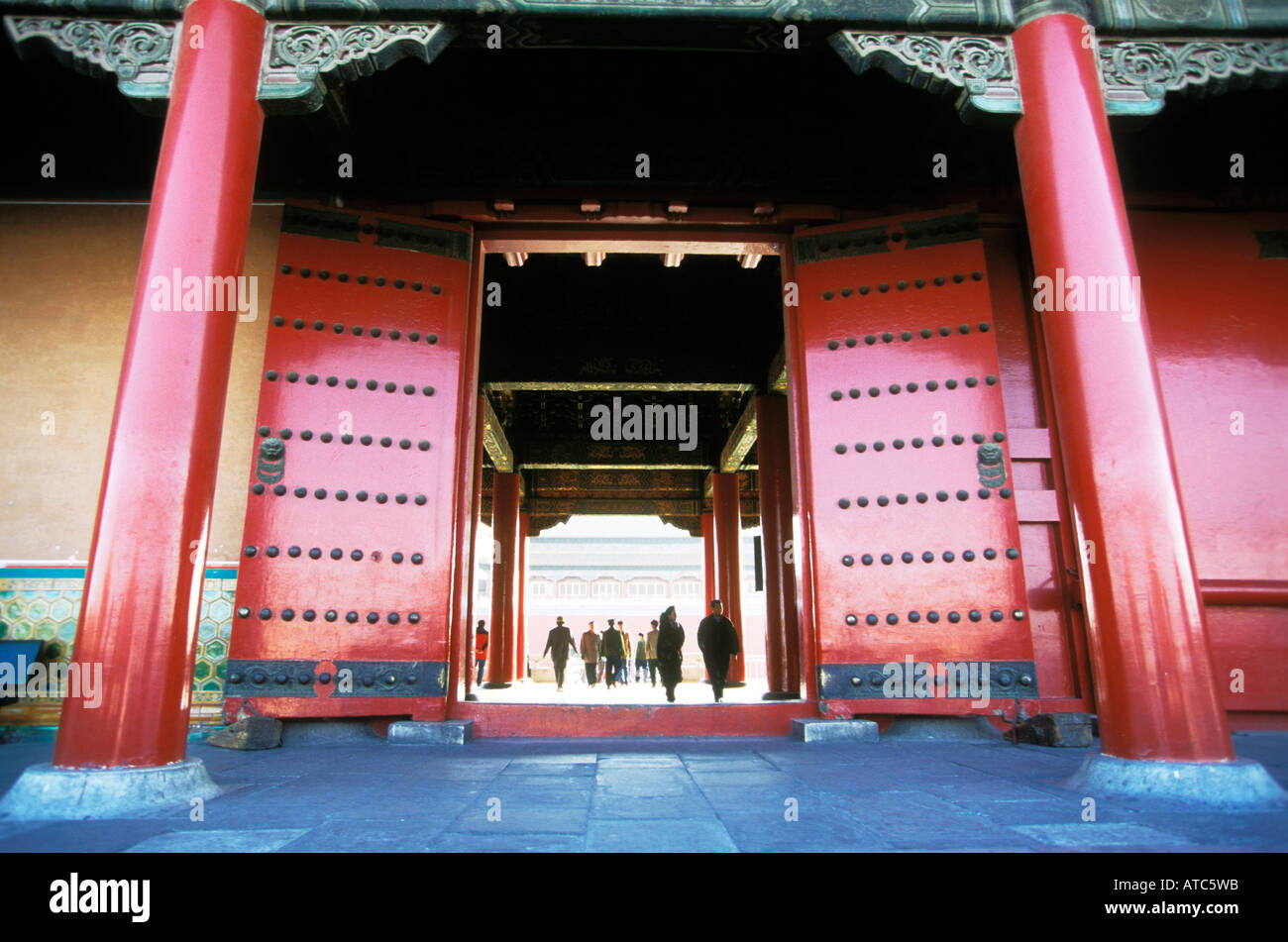 People entering through the colourful Taihemen Gate of Supreme Harmony ...