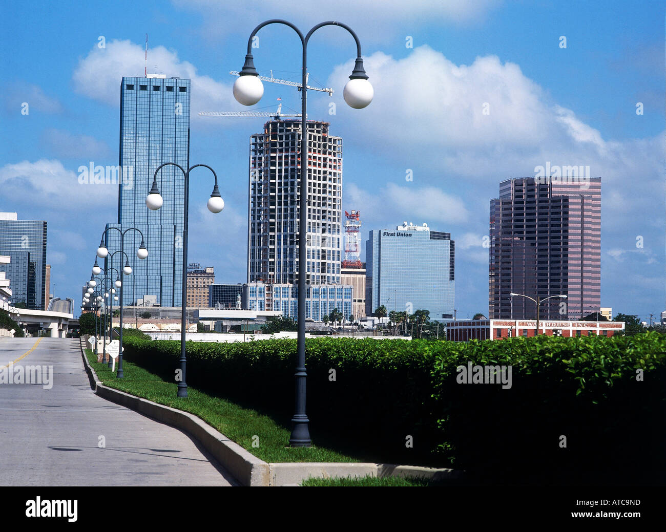 the Tampa skyline happily reflects some modest restrain next to other ...