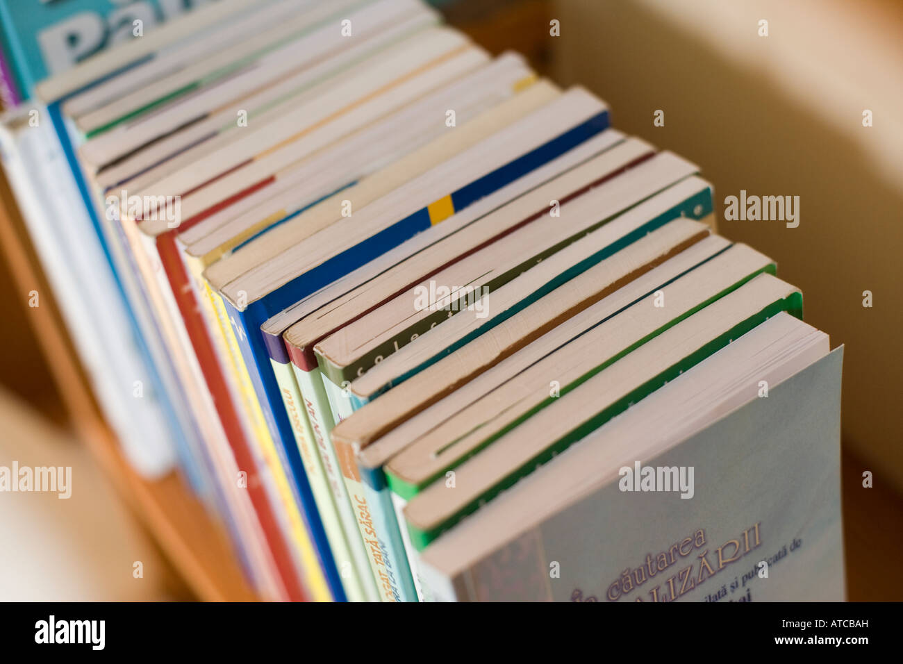 row of books in a library shaft Stock Photo - Alamy