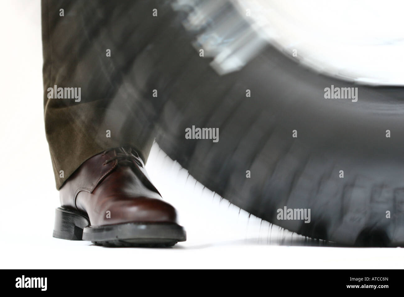 Wheel rolling over a man's foot Stock Photo - Alamy