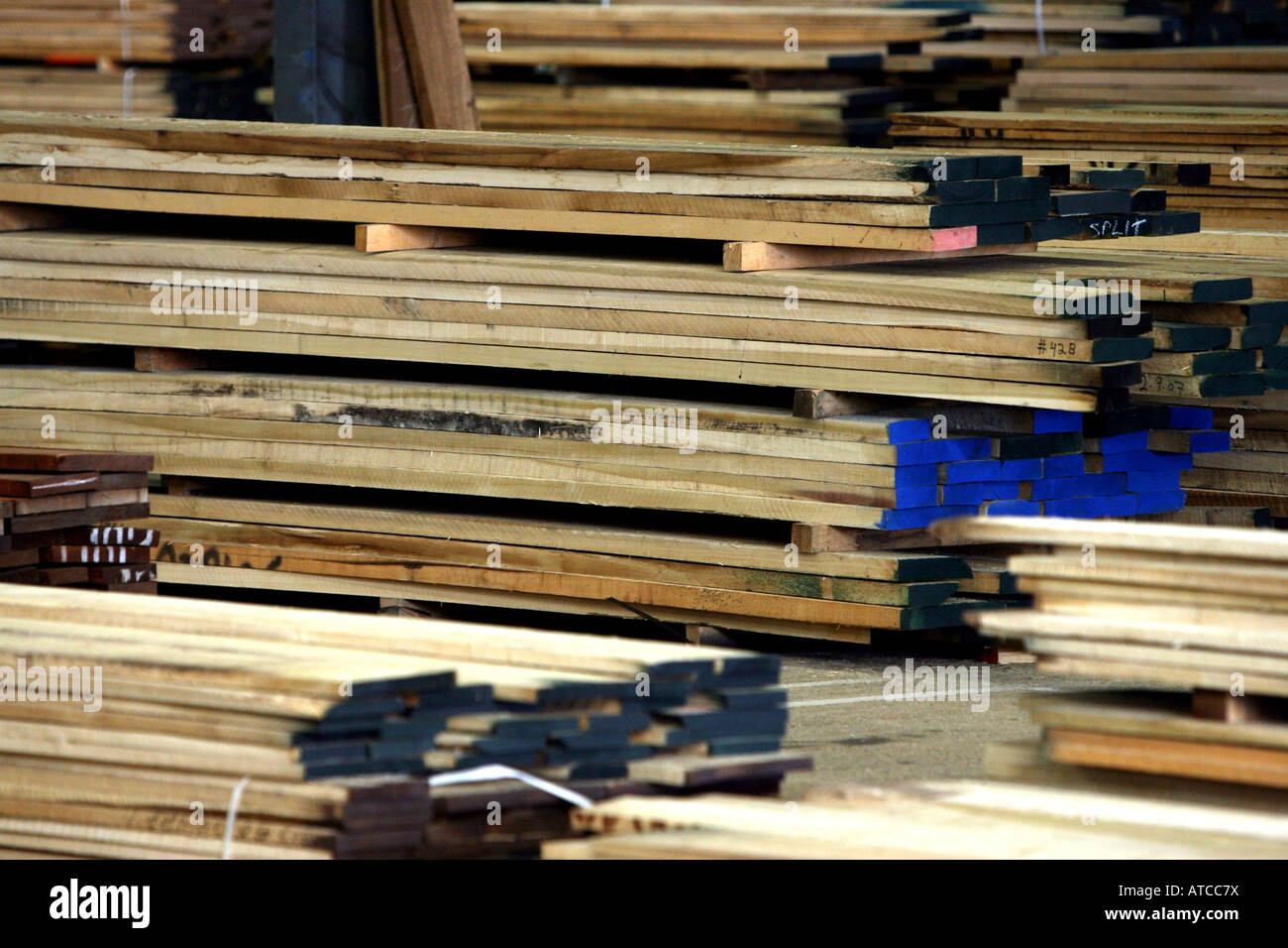 Piles of Timber wood stock at a warehouse in Ely Cambridgeshire Stock ...