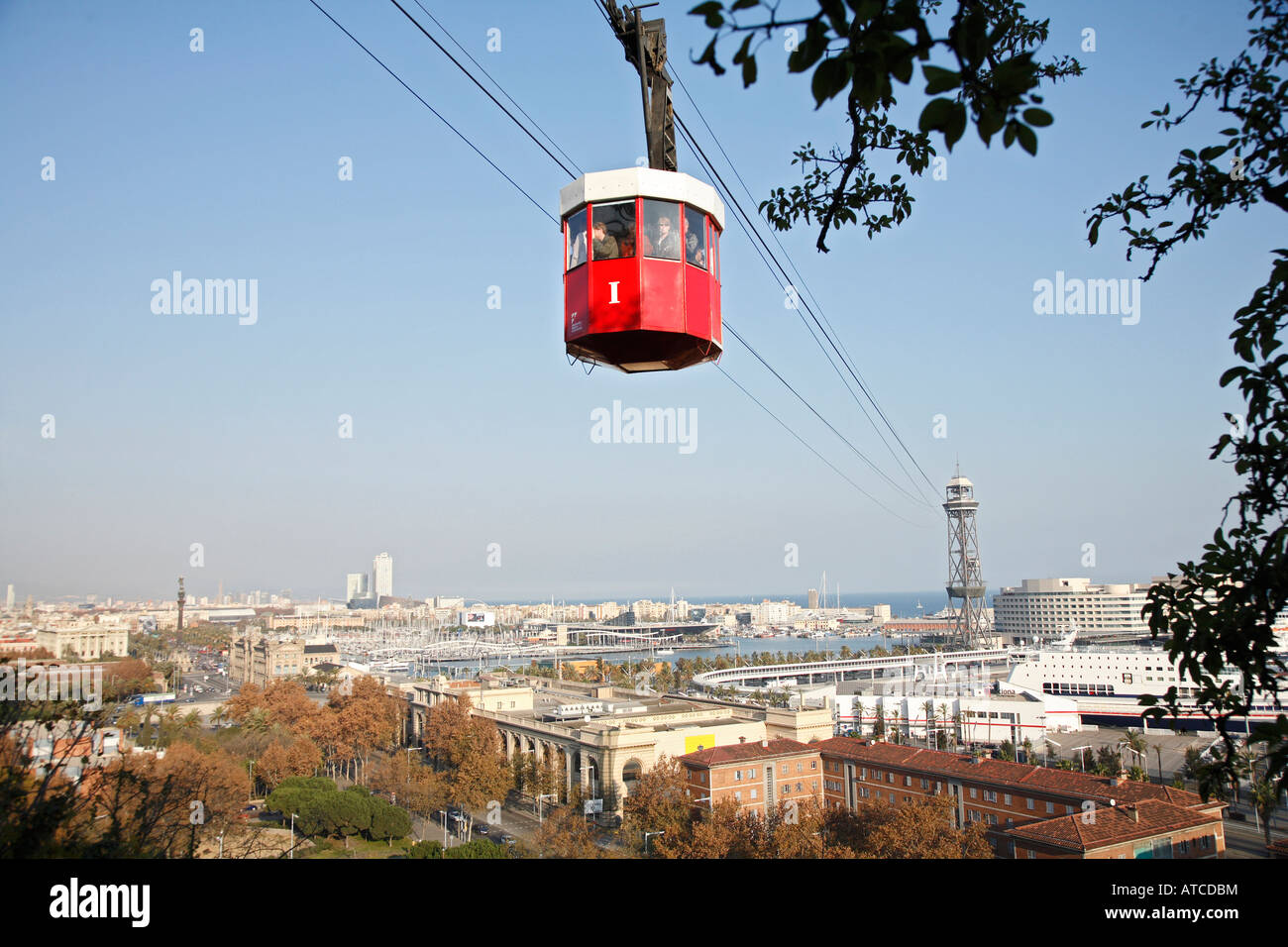 The red Teleferic cable car running across Barcelona Port in Barcelona ...