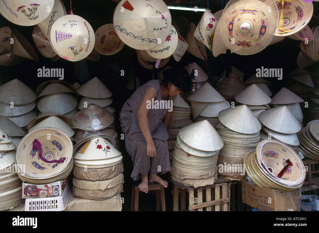 Classic conical coolie hats for sale on a stall in the Dong Ba Market ...