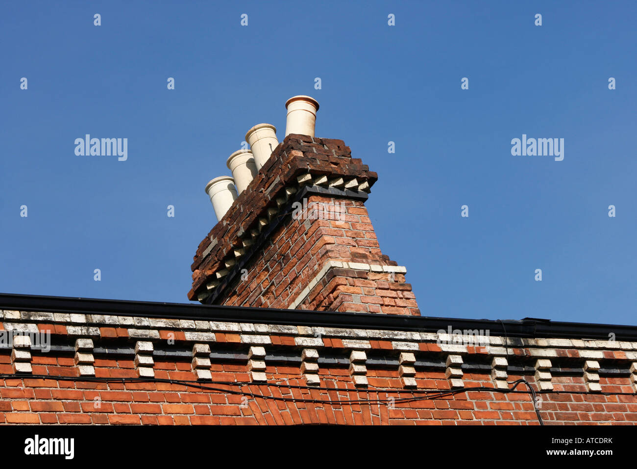 Chimney stack on top of house roof Stock Photo - Alamy