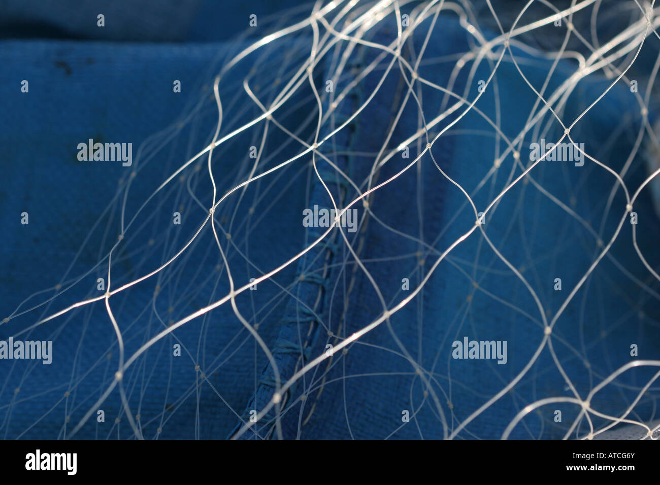 Fine fishing net Stock Photo - Alamy