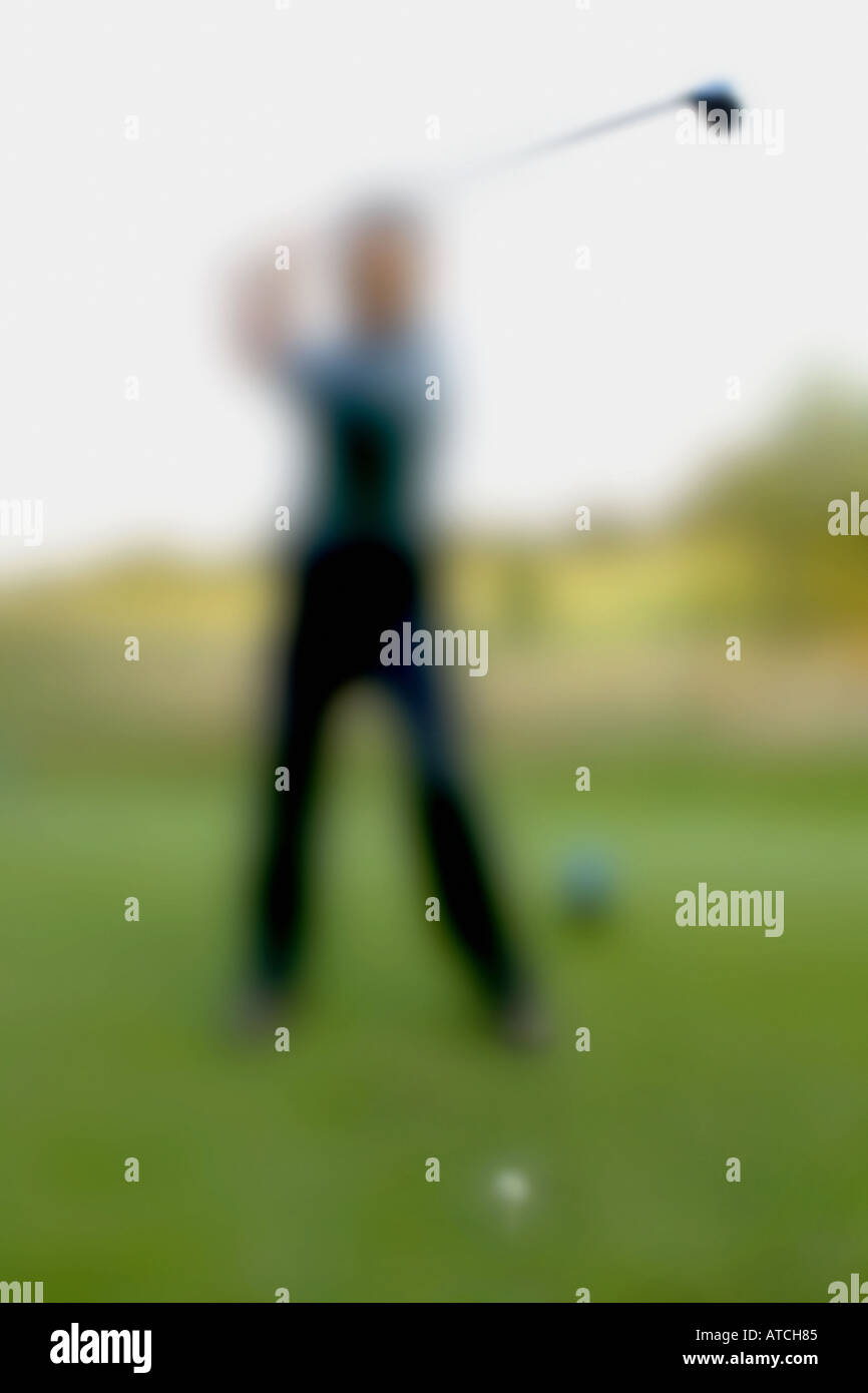 Blurred image of man golfer hitting a golf ball Stock Photo - Alamy