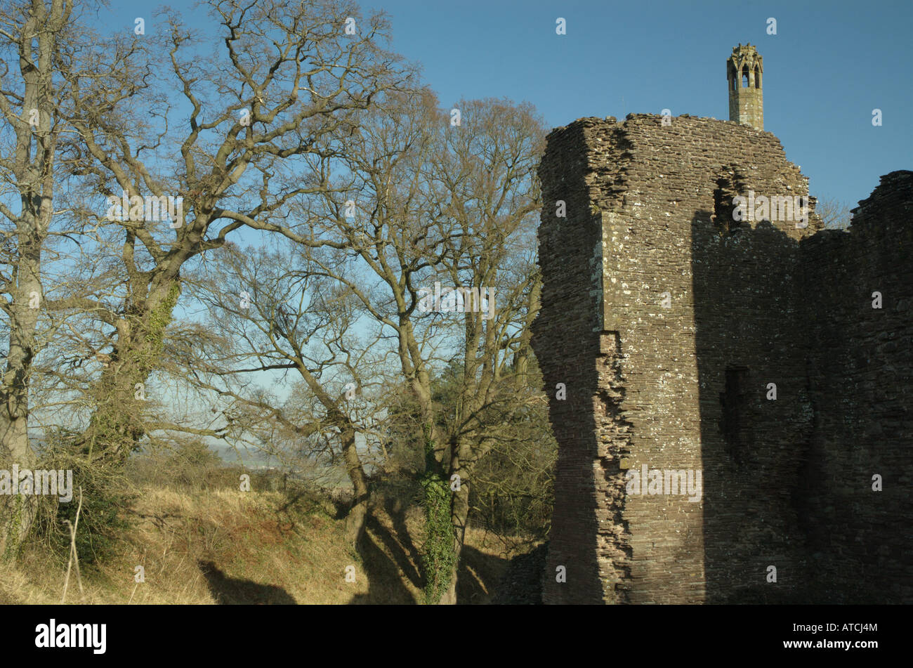 Square tower and wall of ruined castle Stock Photo - Alamy