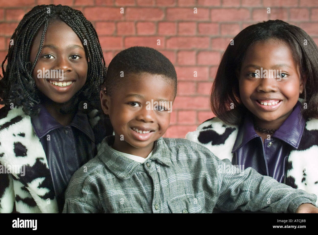Portrait three African American siblings Stock Photo - Alamy