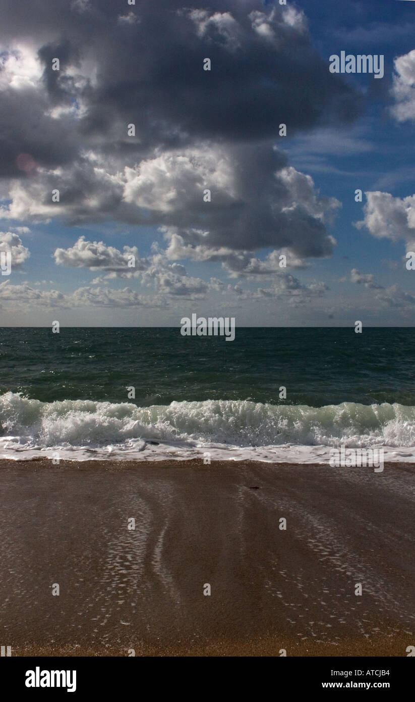 Waves breaking on Shingle Beach Stock Photo - Alamy