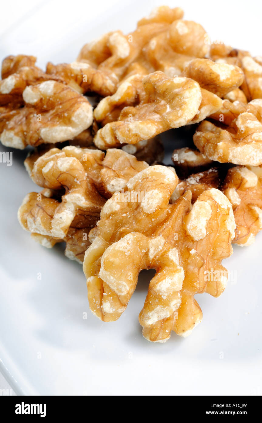 Nuts shelled walnuts white plate hi-res stock photography and images ...
