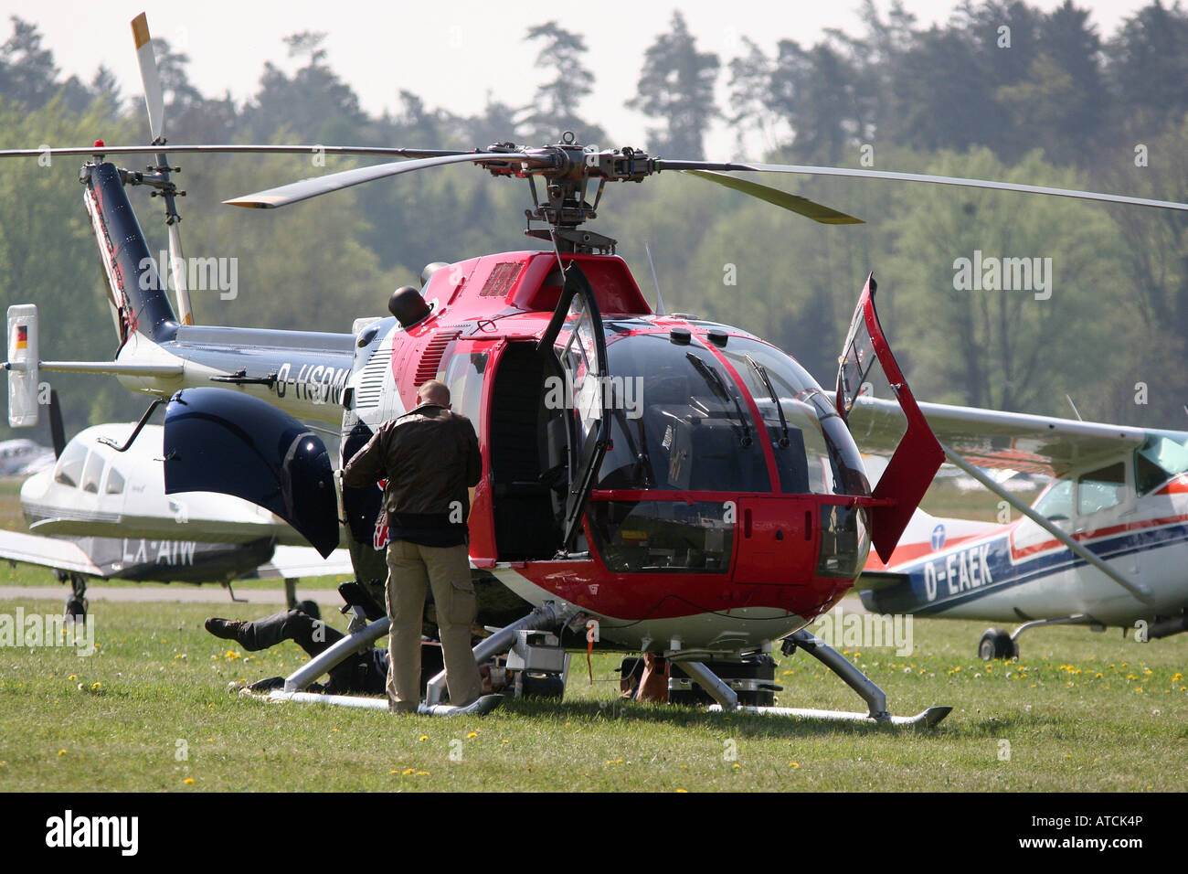 red landed helicopter Stock Photo - Alamy