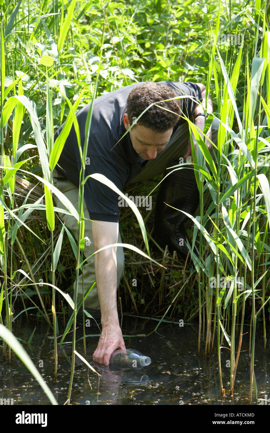 rspb warden collecting a water sample from Leighton Moss reserve for ...