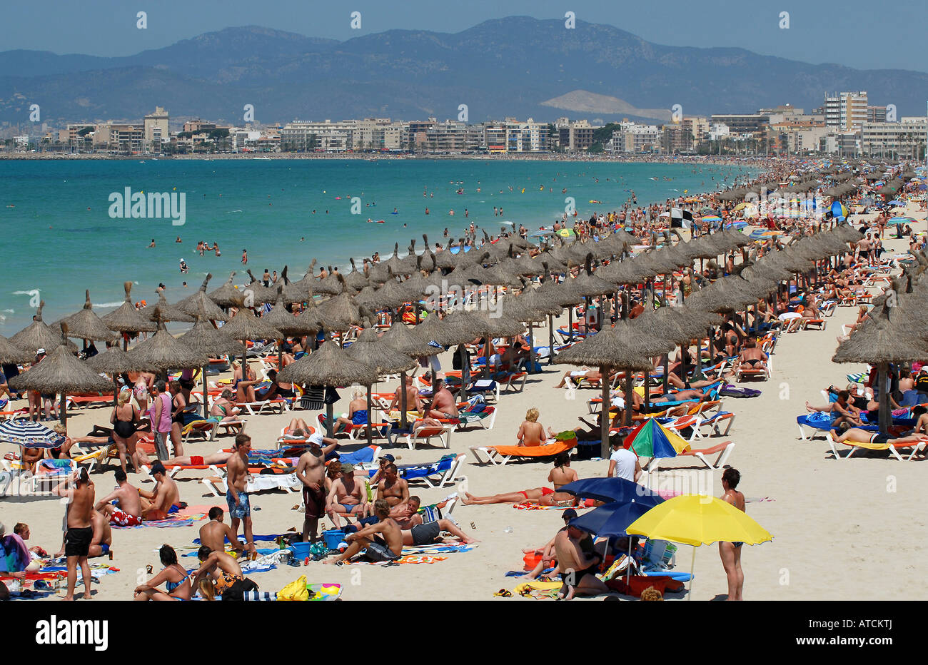 Beach full of tourists, Majorca, Spain Stock Photo - Alamy