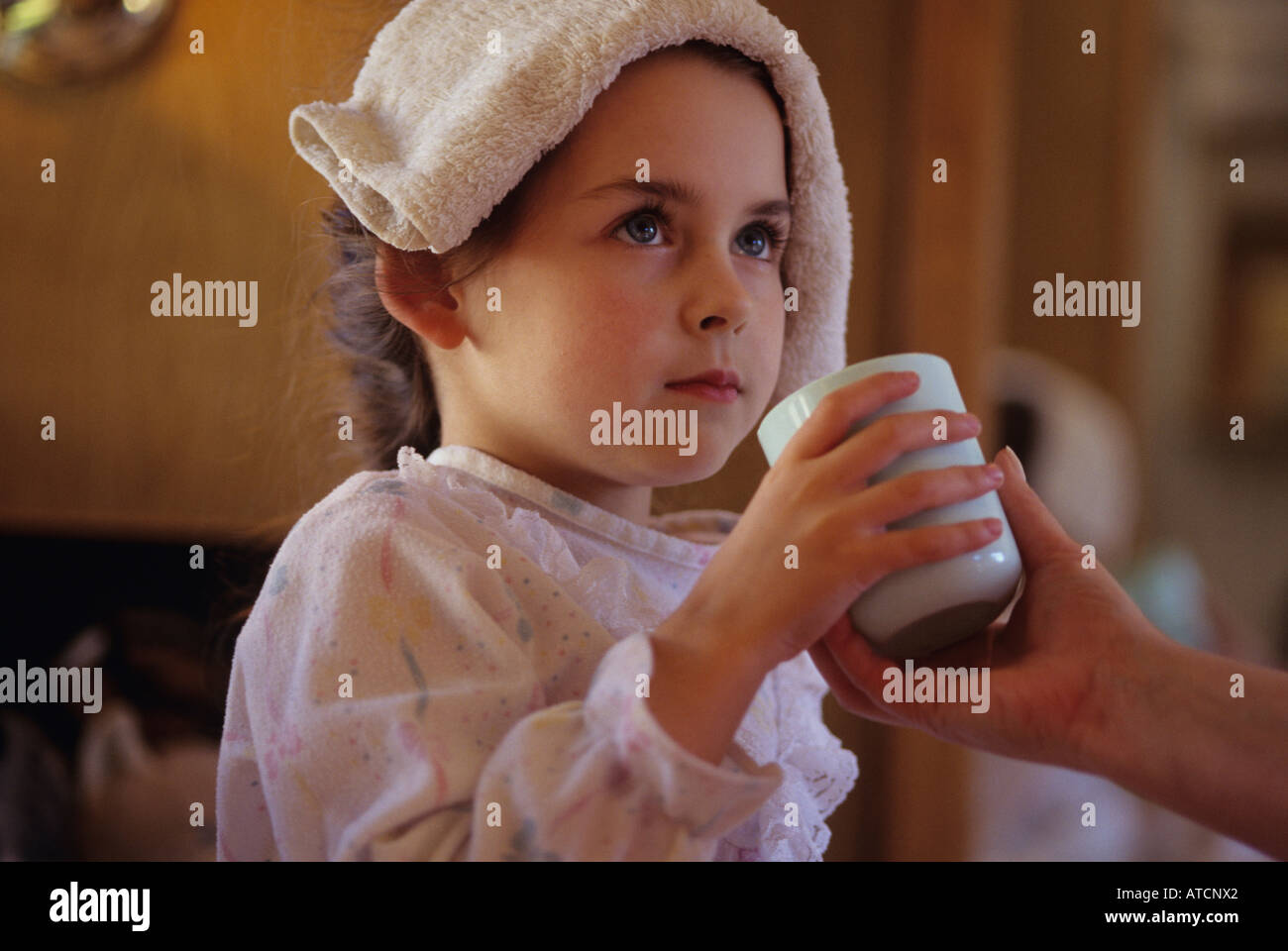 Young girl with flu cold with wash cloth on forehead Stock Photo - Alamy