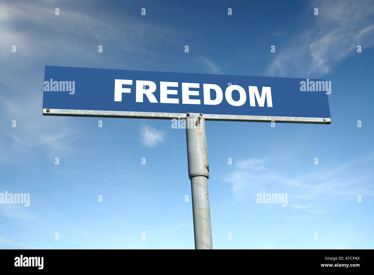 Metal signpost spelling Freedom over blue sky Stock Photo - Alamy