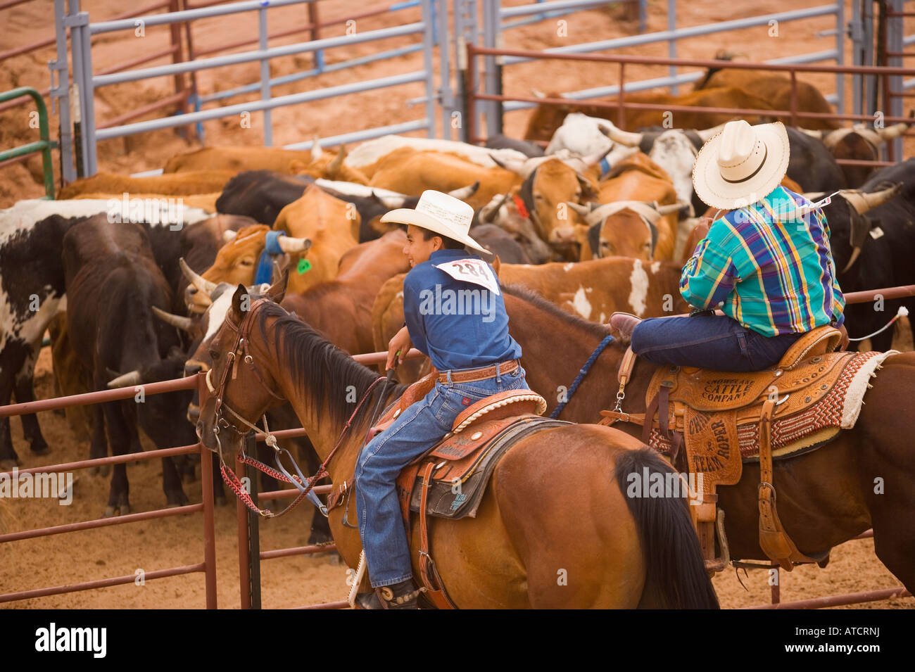young riders wait for their turn to compete in the Pole Bending event ...