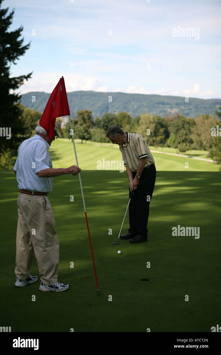 Golf player at golf course Stock Photo - Alamy