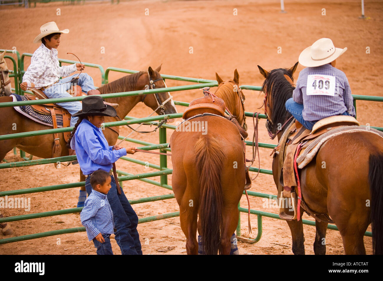young riders wait to compete in the Pole Bending event All Indian Rodeo ...
