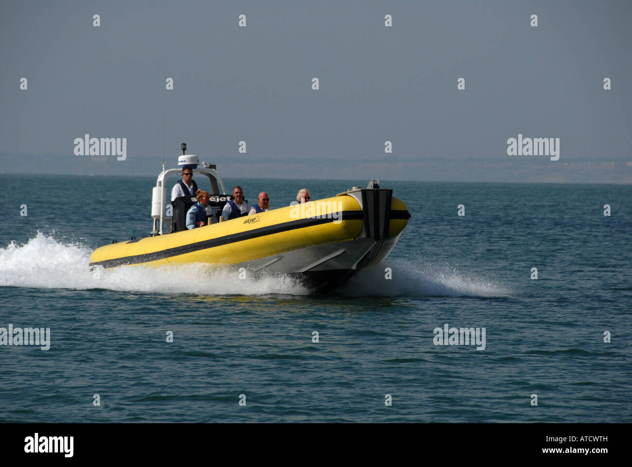 A speed boat carrying visitors on a local sightseeing trip on the ...