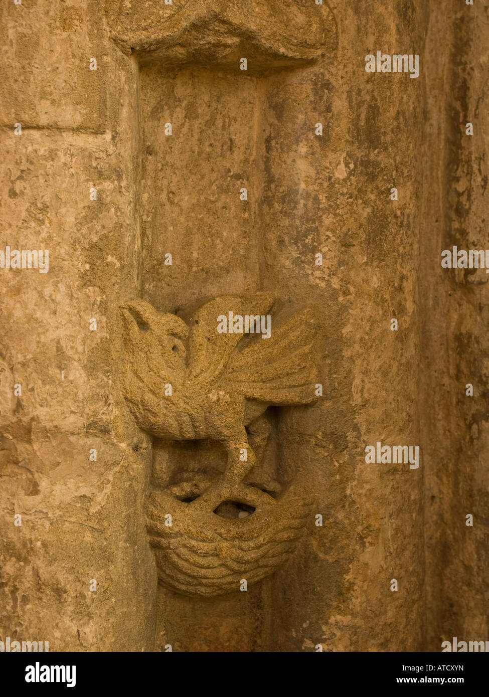 Stone bird on a nest Stock Photo - Alamy