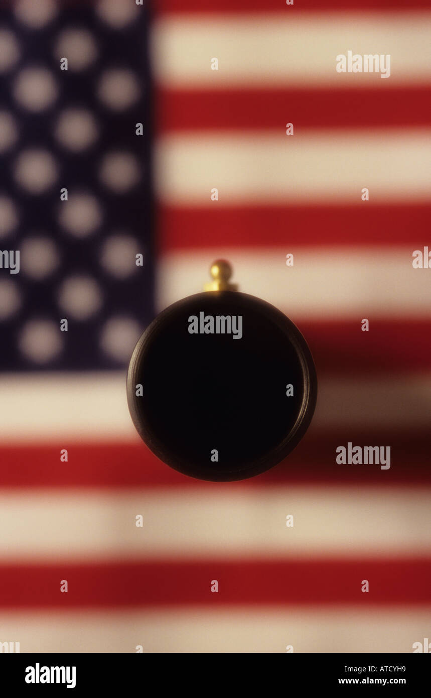Shotgun barrel protruding out of an American flag Stock Photo - Alamy