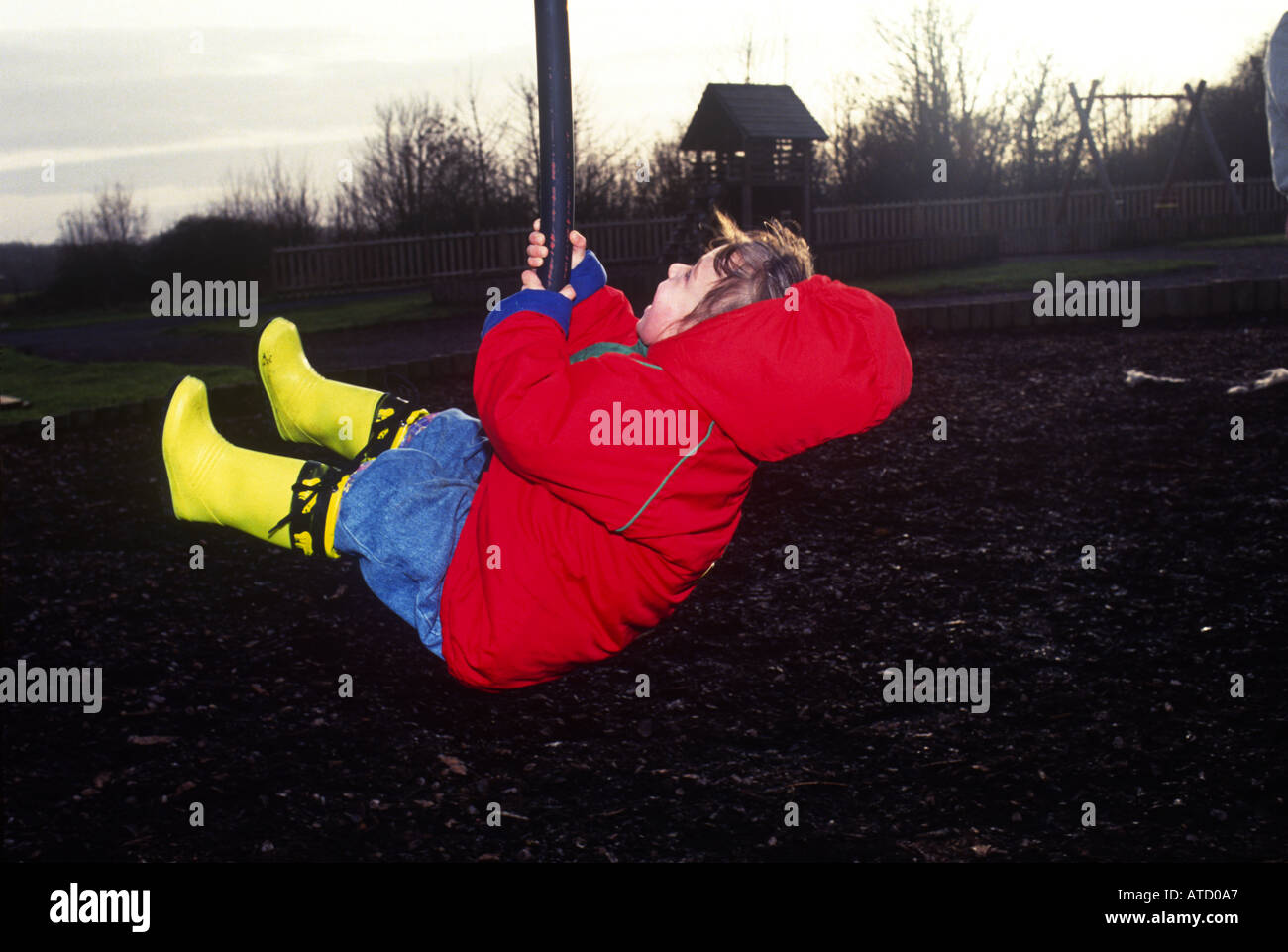 Child on swing SB Stock Photo - Alamy