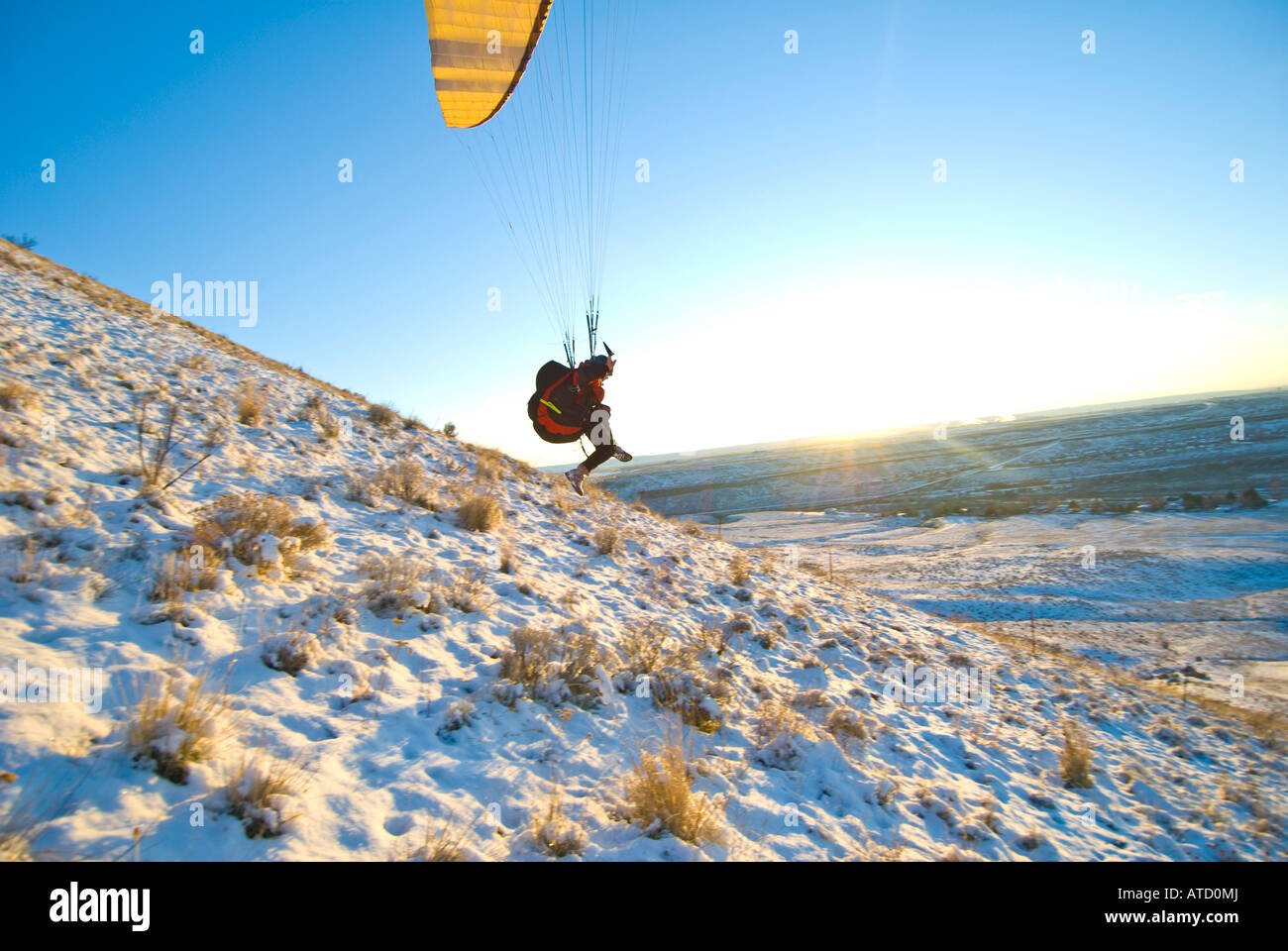 Idaho Paragliding in winter at sunset Stock Photo - Alamy