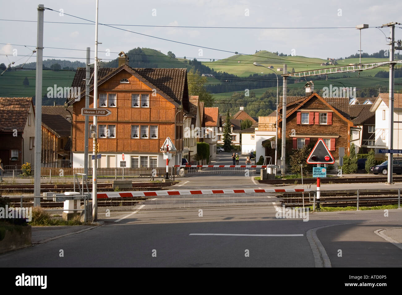 Crossing gate arm in place blocking railroad train crossing Appenzell ...