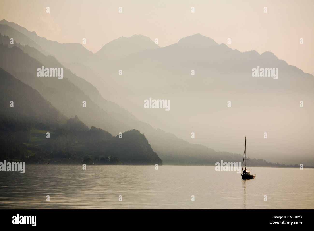 Sailboat at sunset on the Brienzersee Brienz Switzerland Stock Photo ...