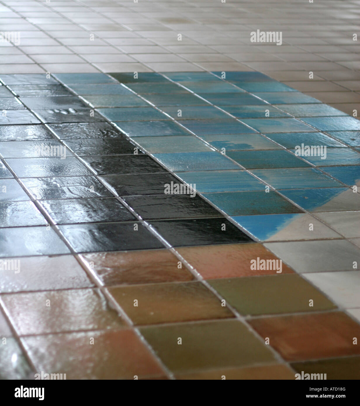 Ceramic tile floor with interesting pattern fading into the distance ...