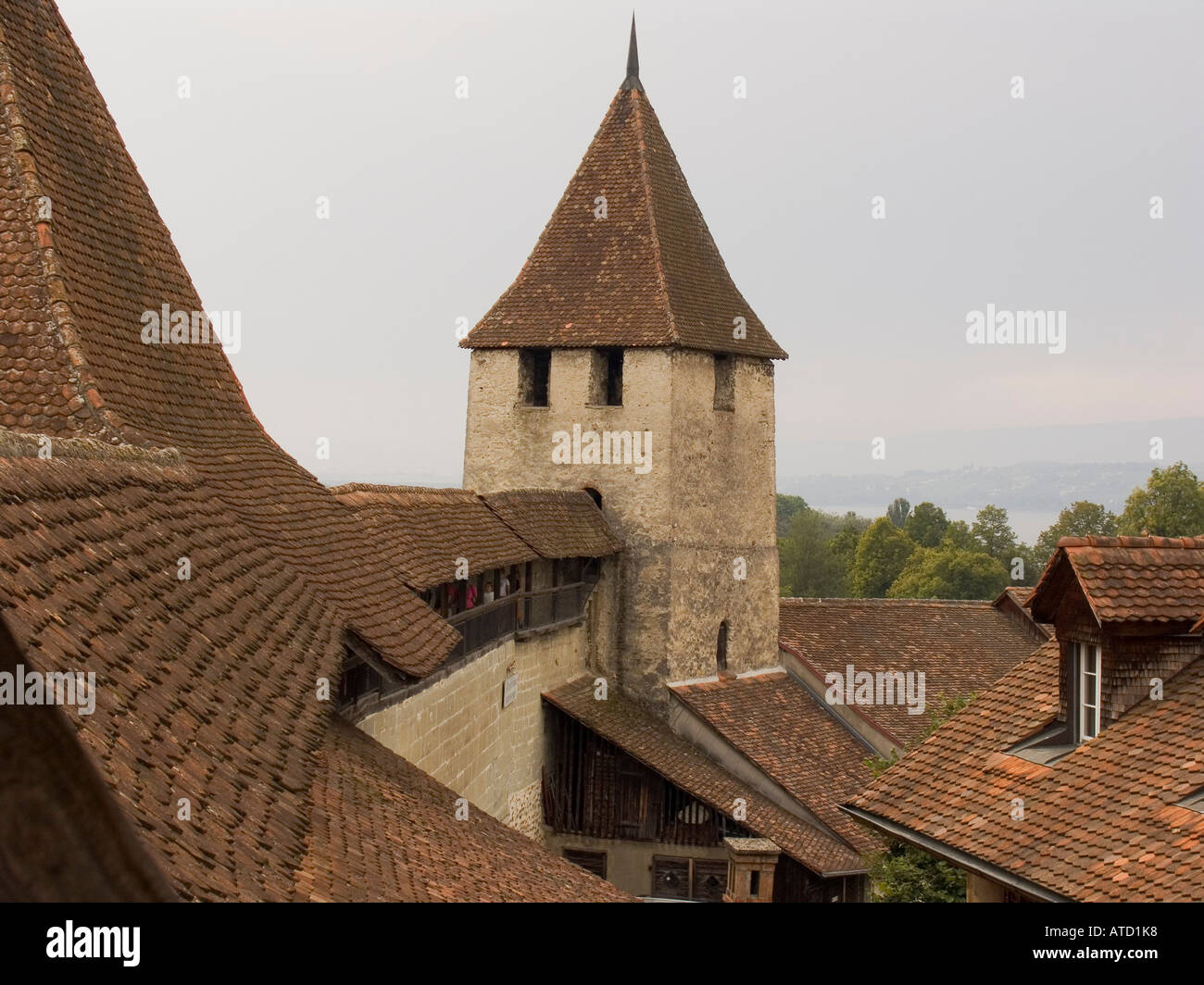 View of rooftops and houses and the fortified wall of the medevial town ...