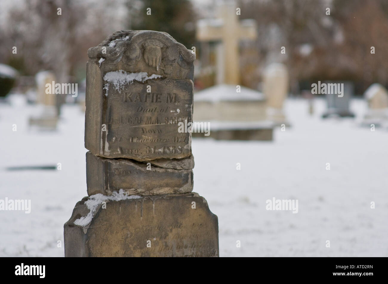 A gravestone at a cemetery in winter Stock Photo - Alamy