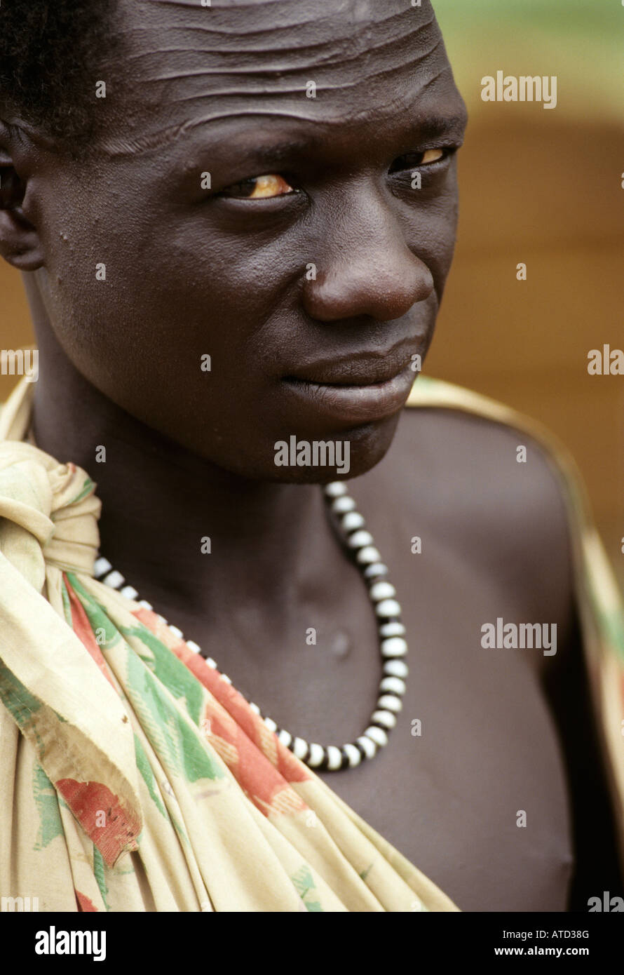 Nuer man with white beads Stock Photo - Alamy