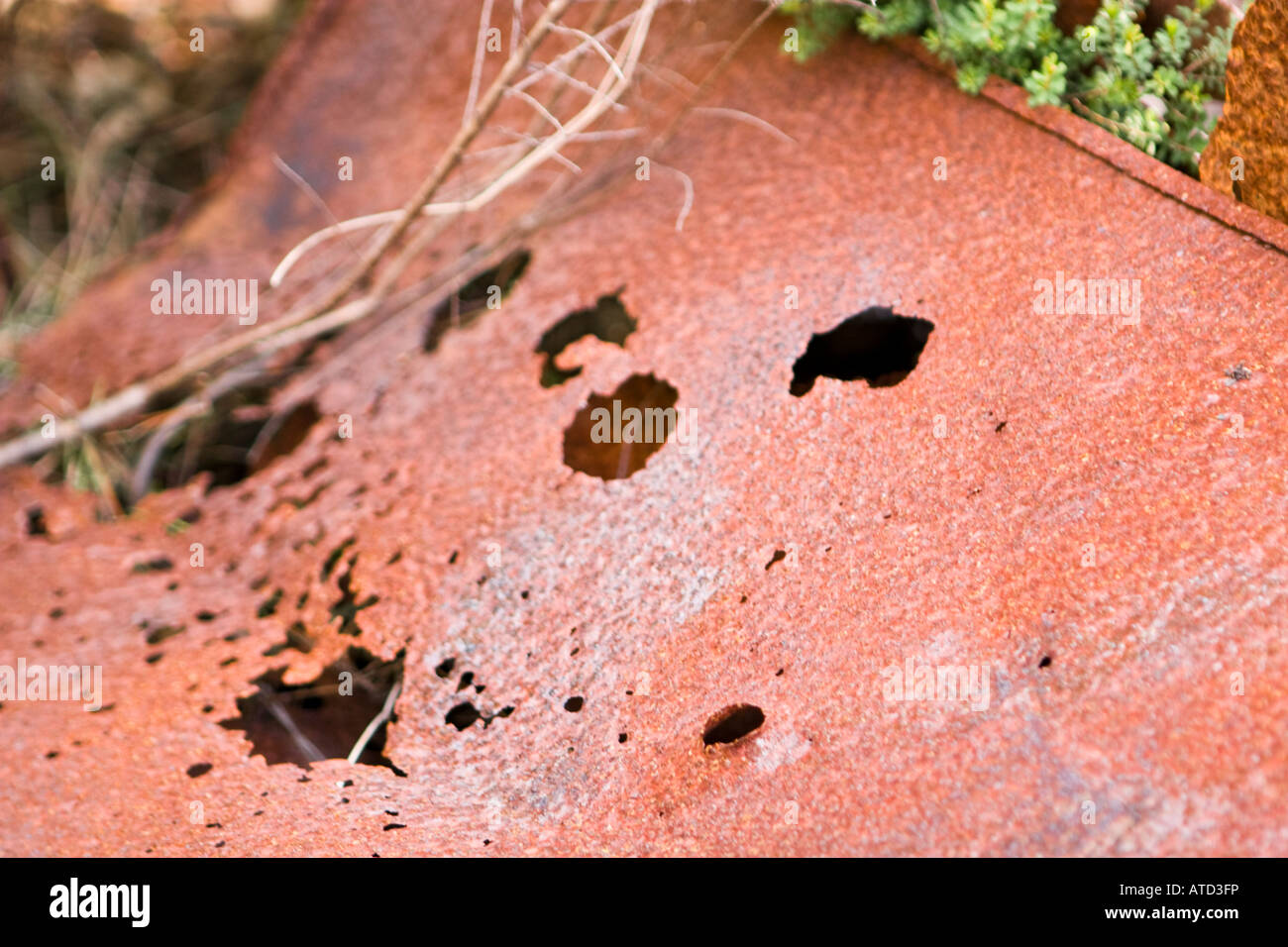 A rusty piece of metal laying on the ground Stock Photo - Alamy